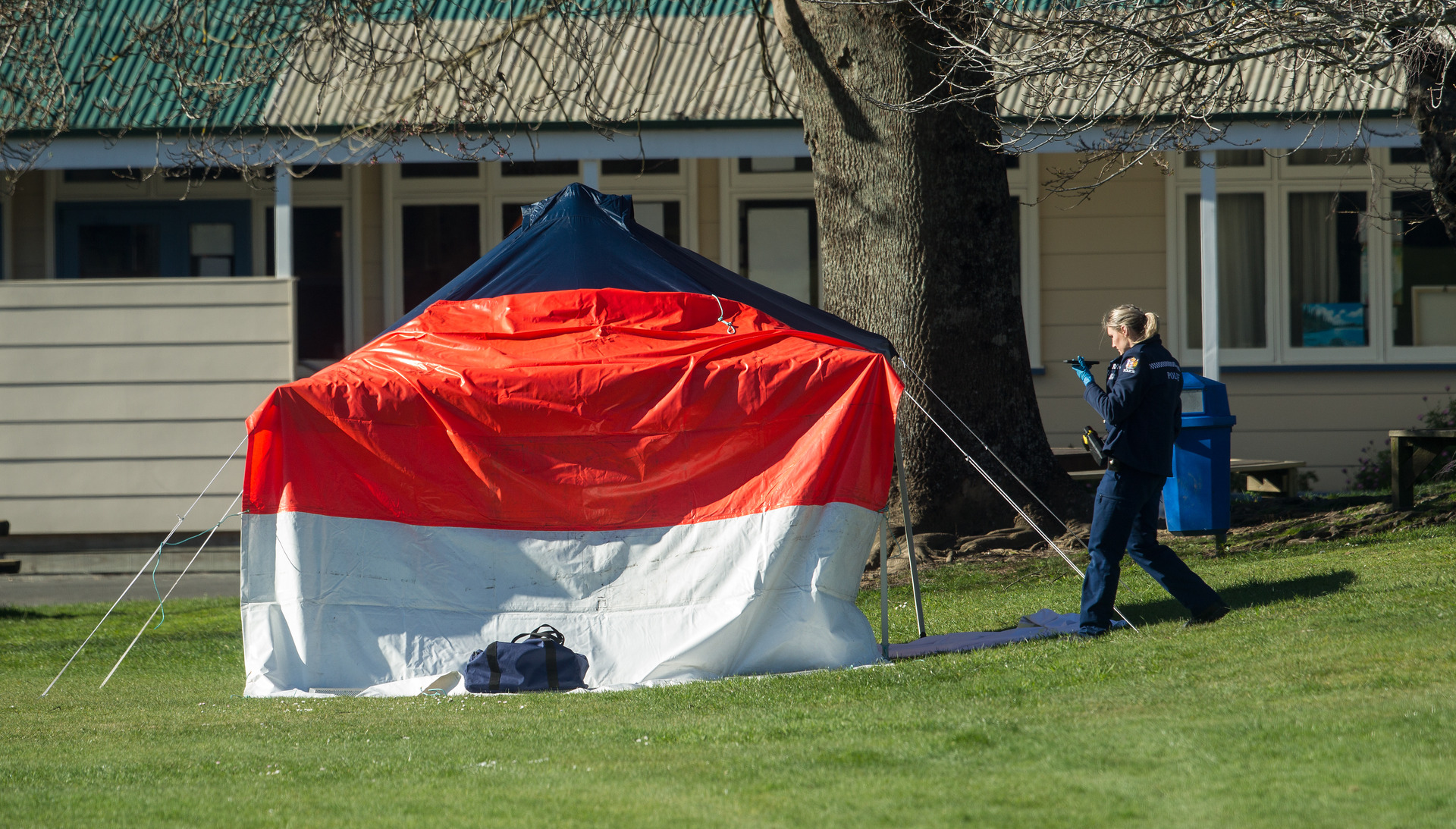 School reopens as police probe young mum's murder